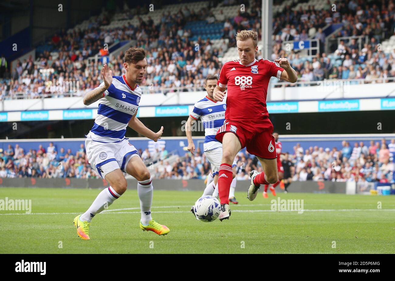 Queens Park Rangers' Grant Hall and Birmingham City's Maikel ...