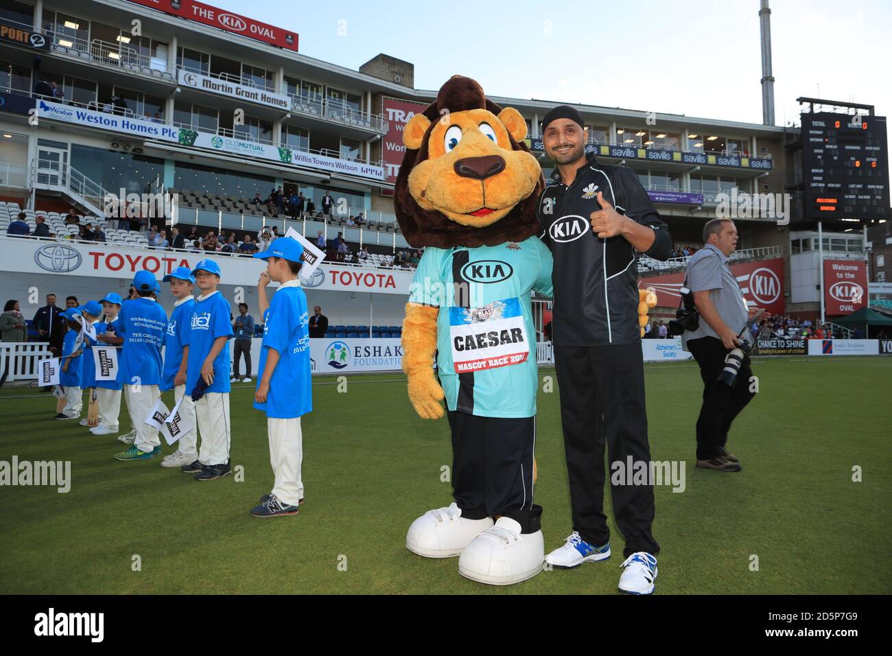 Surrey's Harbhajan Singh with mascot Caesar Stock Photo - Alamy