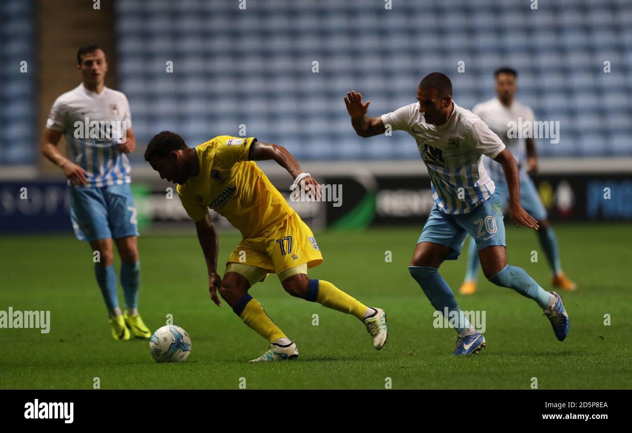 Coventry City's Marcus Tudgay (right) and AFC Wimbledon's Andy Barcham ...