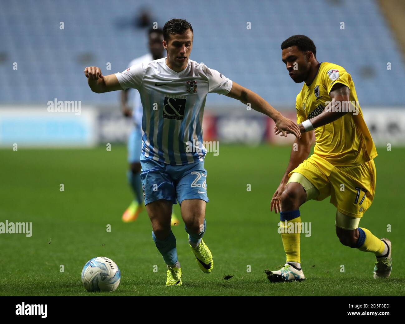 Coventry City's James Sterry (left) and AFC Wimbledon's Andy Barcham ...