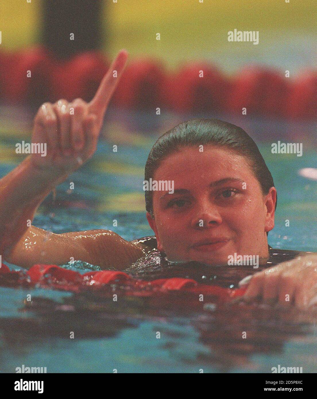 England's Sue Rolph shows she is number one after winning the gold ...