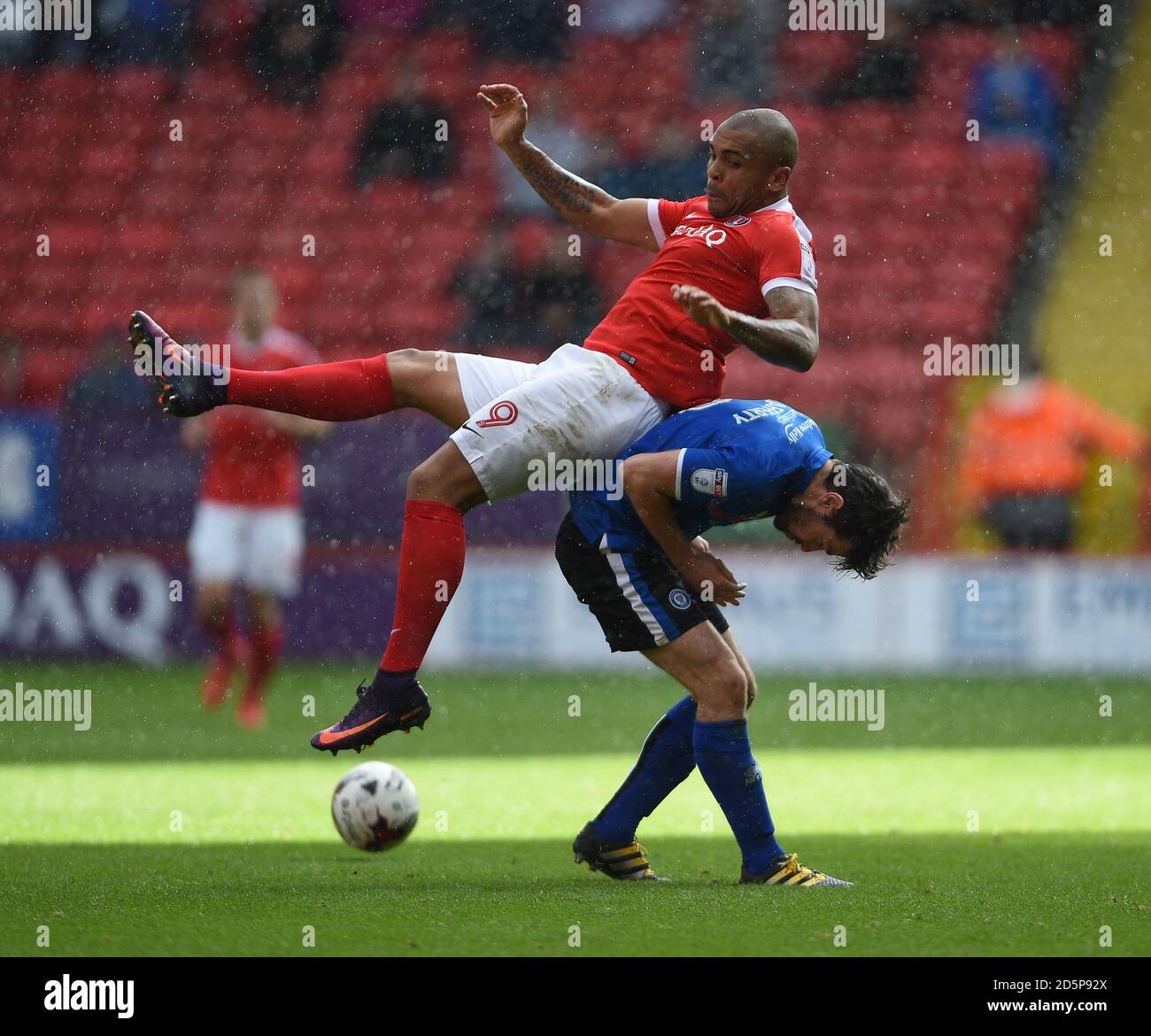 Charlton Athletic's Josh Magennis (left) and RochdaleÕs Joe Rafferty ...