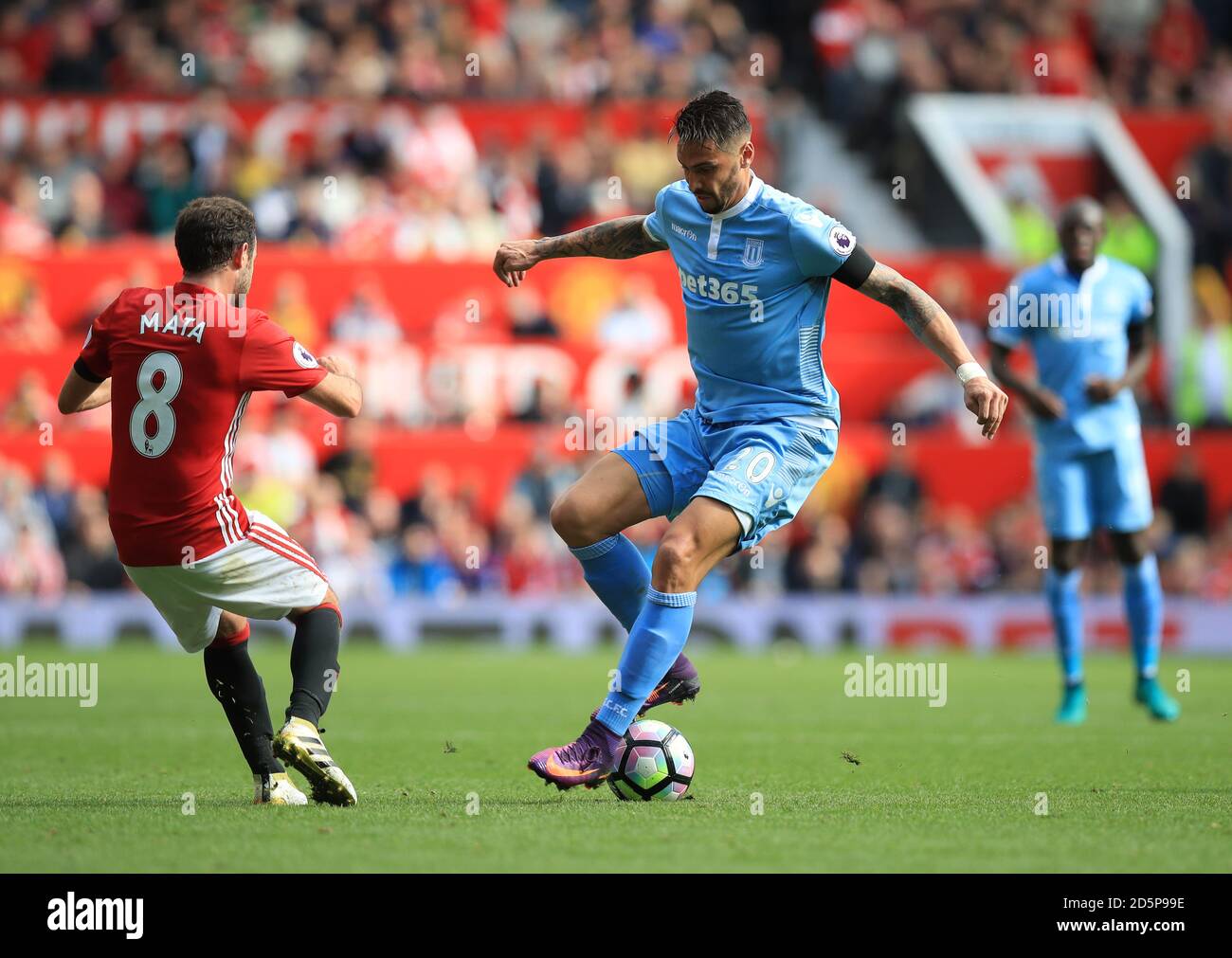 Manchester United's Juan Mata and Stoke City's Geoff Cameron battle for ...