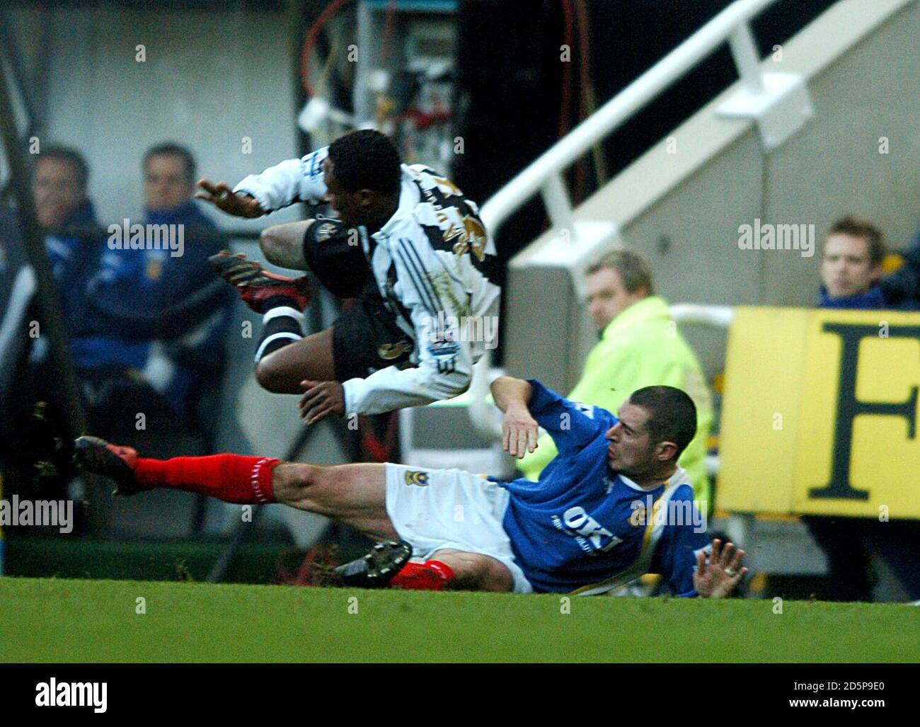 Portsmouth's Andy Griffin challenges Newcastle Untied's Celestine ...