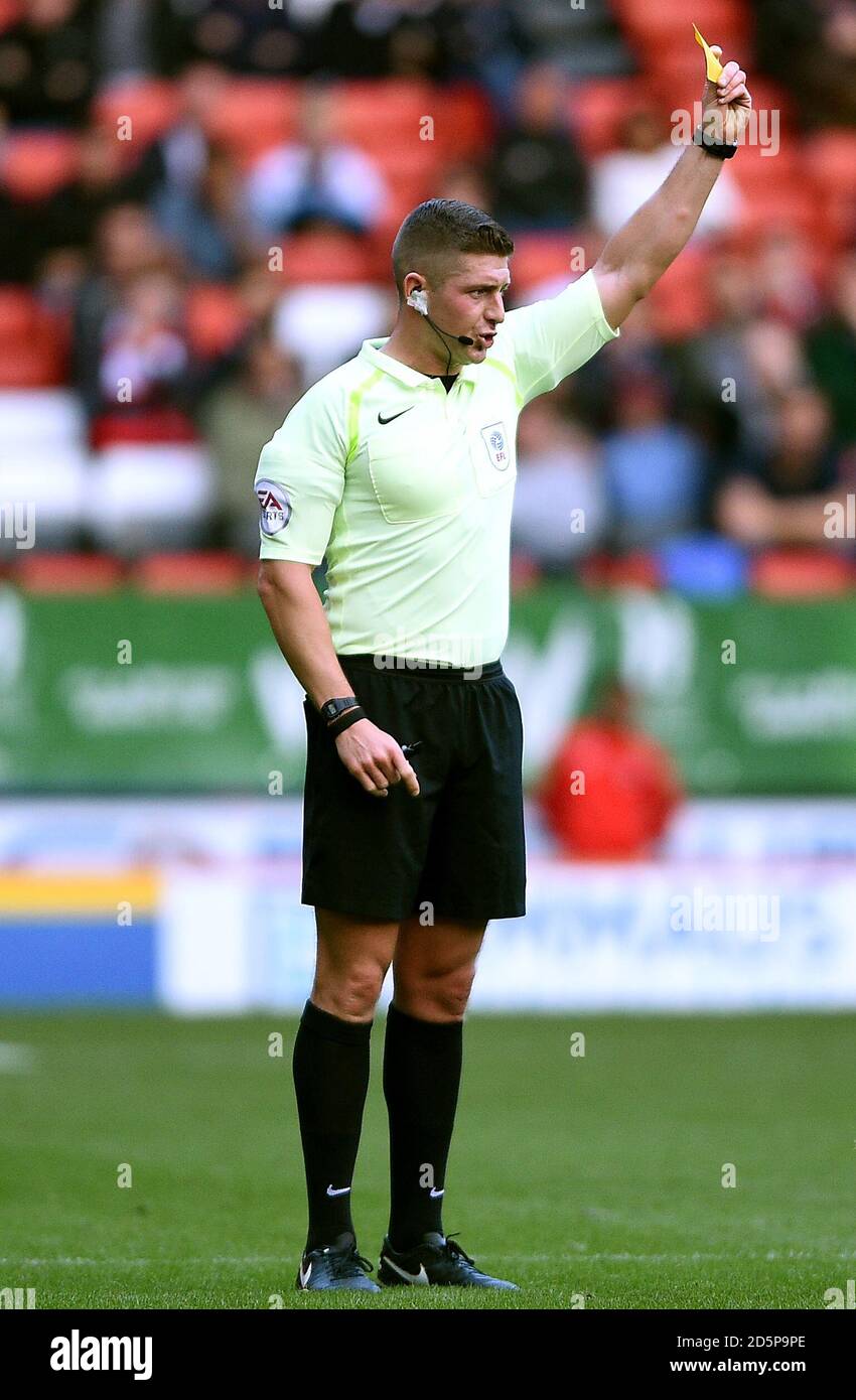 Referee Robert Jones shows a yellow card Stock Photo - Alamy