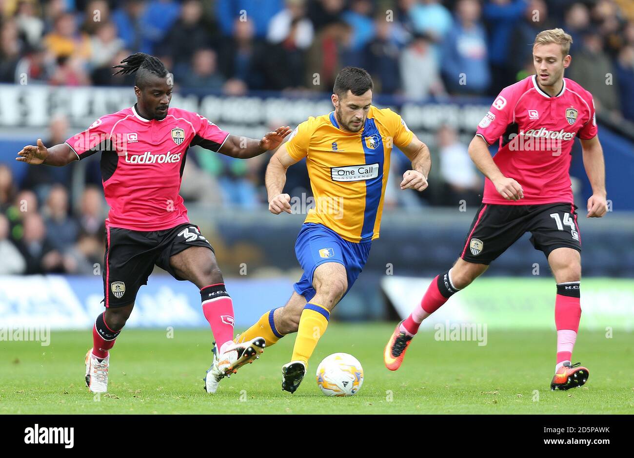 Mansfield Town's Pat Hoban (centre) in action with Notts County's ...