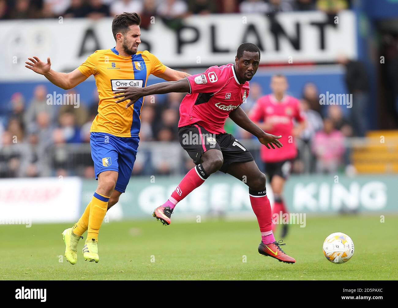 Mansfield Town's Chris Clements (left) and Notts County's Jonathan ...