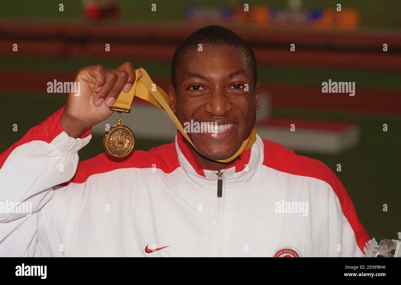 England's Onochie Achike celebrates with his gold medal Stock Photo - Alamy