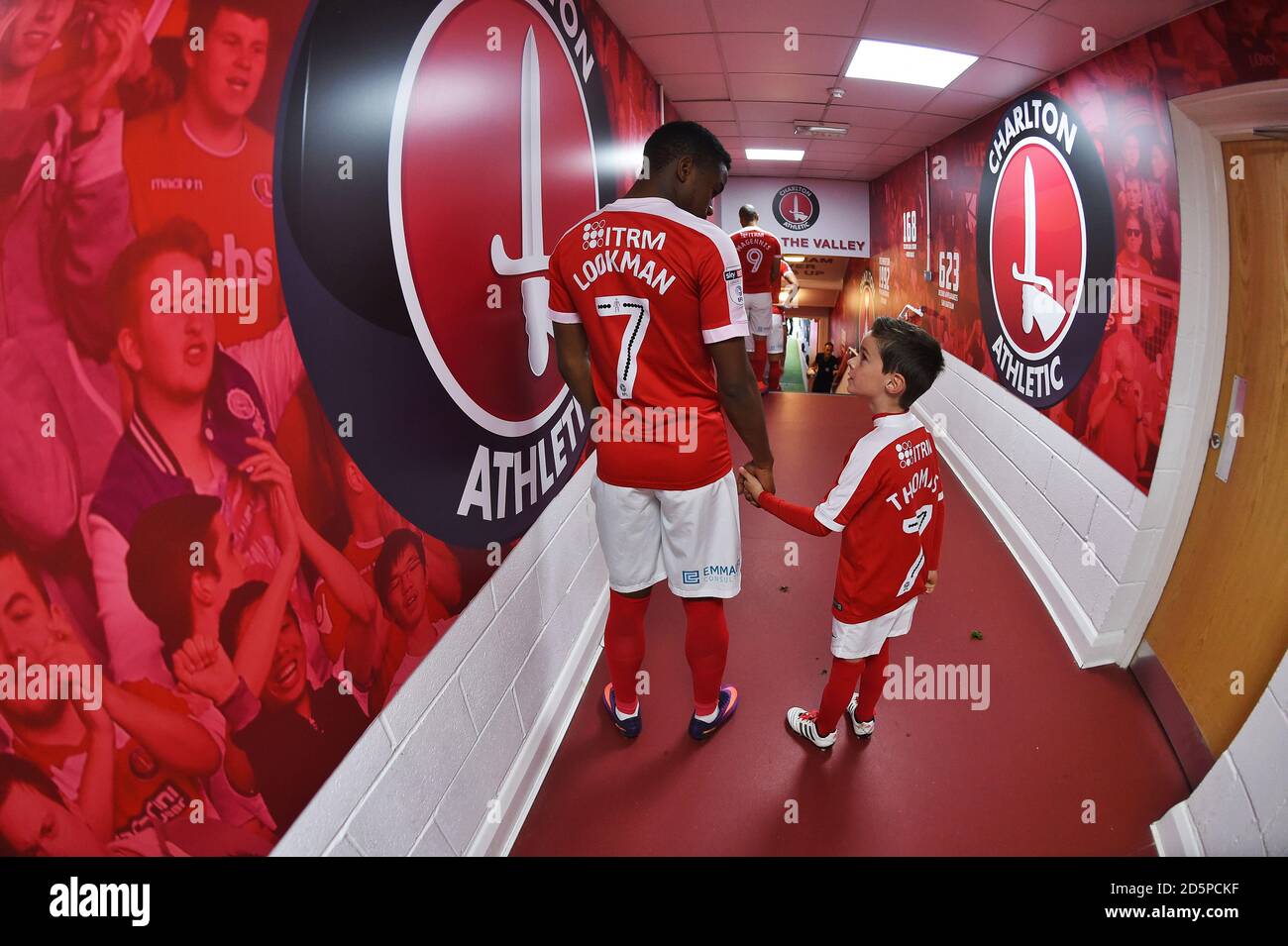 Charlton Athletic's Ademola Lookman stands waiting with a mascot in the ...