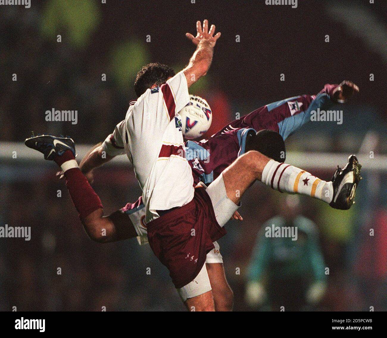 West Ham United's Andrew Impey (right) battles with Northampton Town's ...