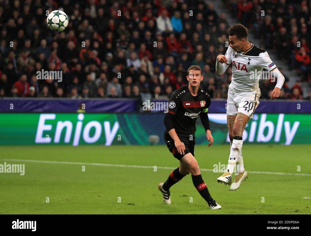 Tottenham Hotspur's Dele Alli (right) gets a header towards goal Stock ...