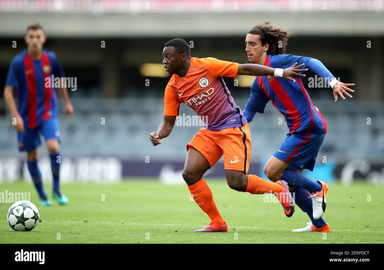 Barcelona's Cucu (left) and Manchester City's Aaron Nemane (right ...