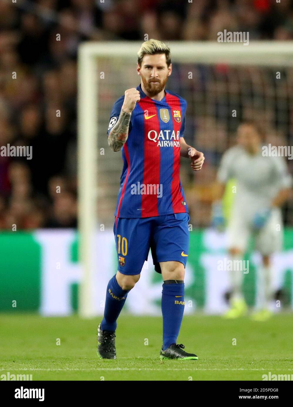 Barcelona's Lionel Messi celebrates scoring his side's first goal of ...