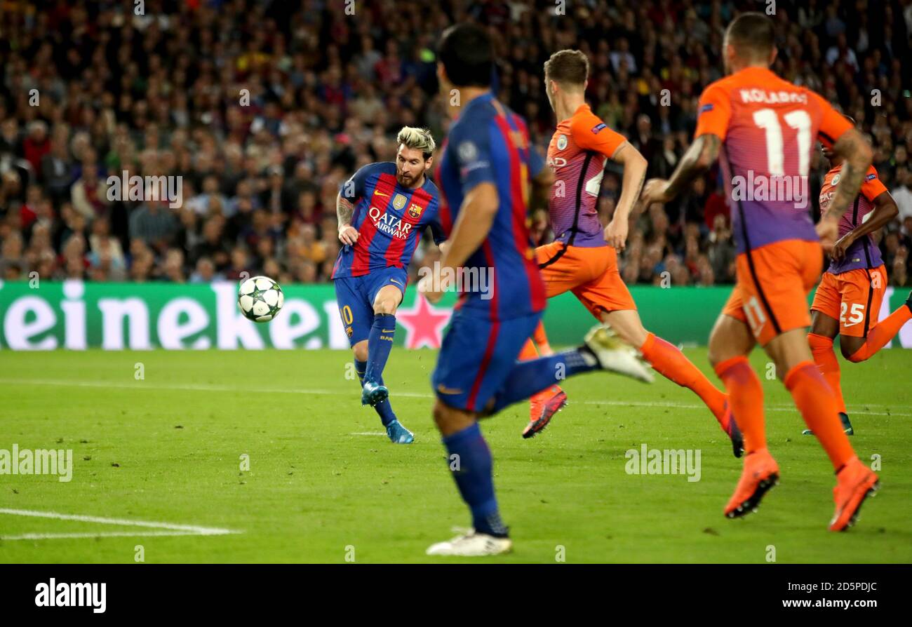Barcelona's Lionel Messi scores his side's third goal of the game Stock ...