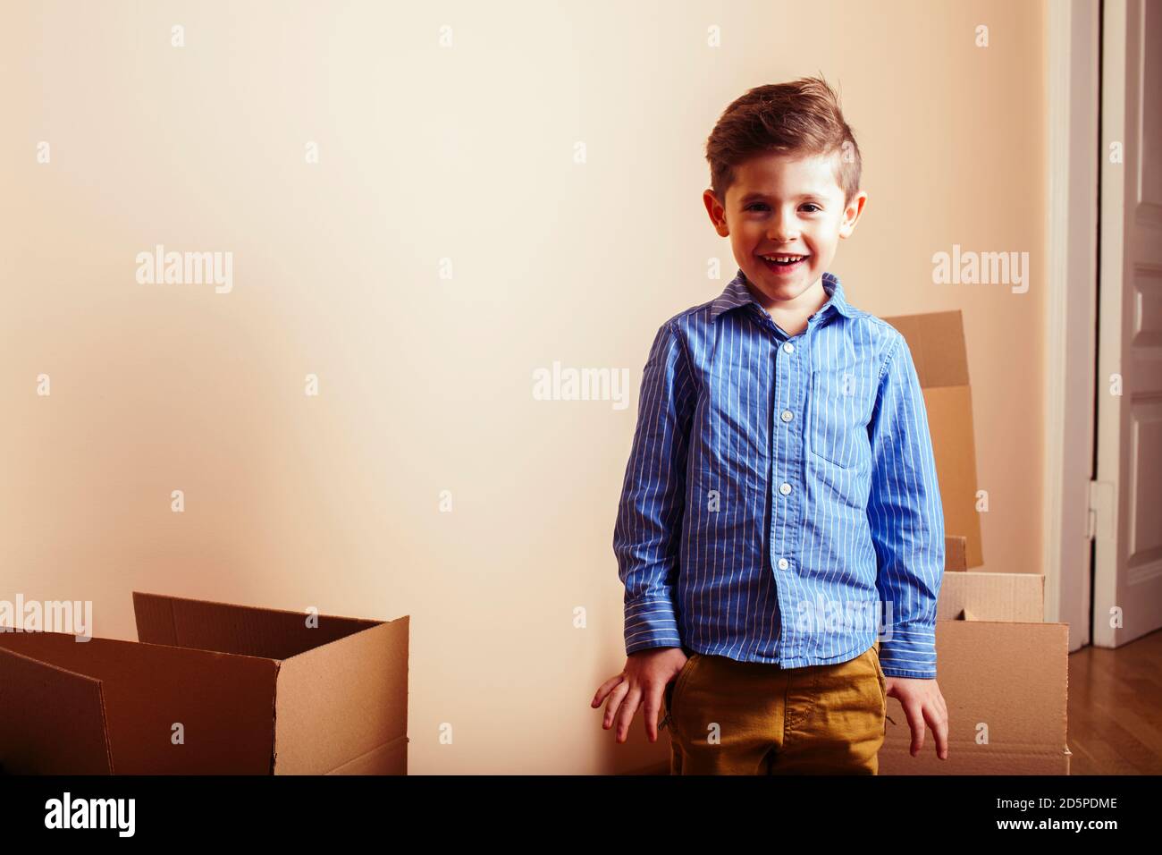 little cute boy in empty room, move to new house. home alone among ...