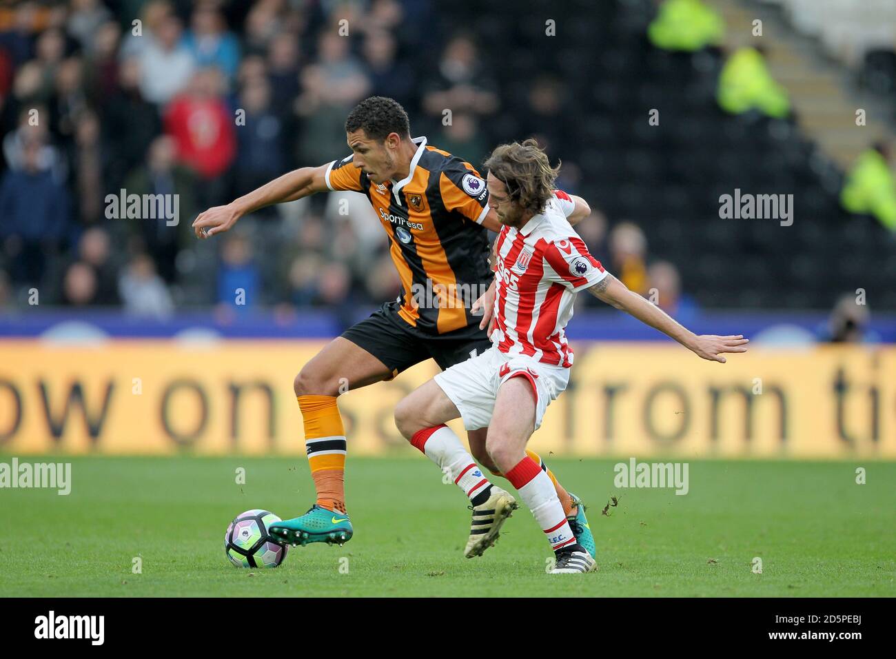 Hull City's Jake Livermore and Stoke City's Joe Allen challenge Stock ...