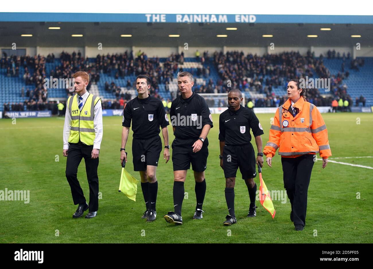 Referee Mark Haywood and his assistants leave the pitch after the game ...
