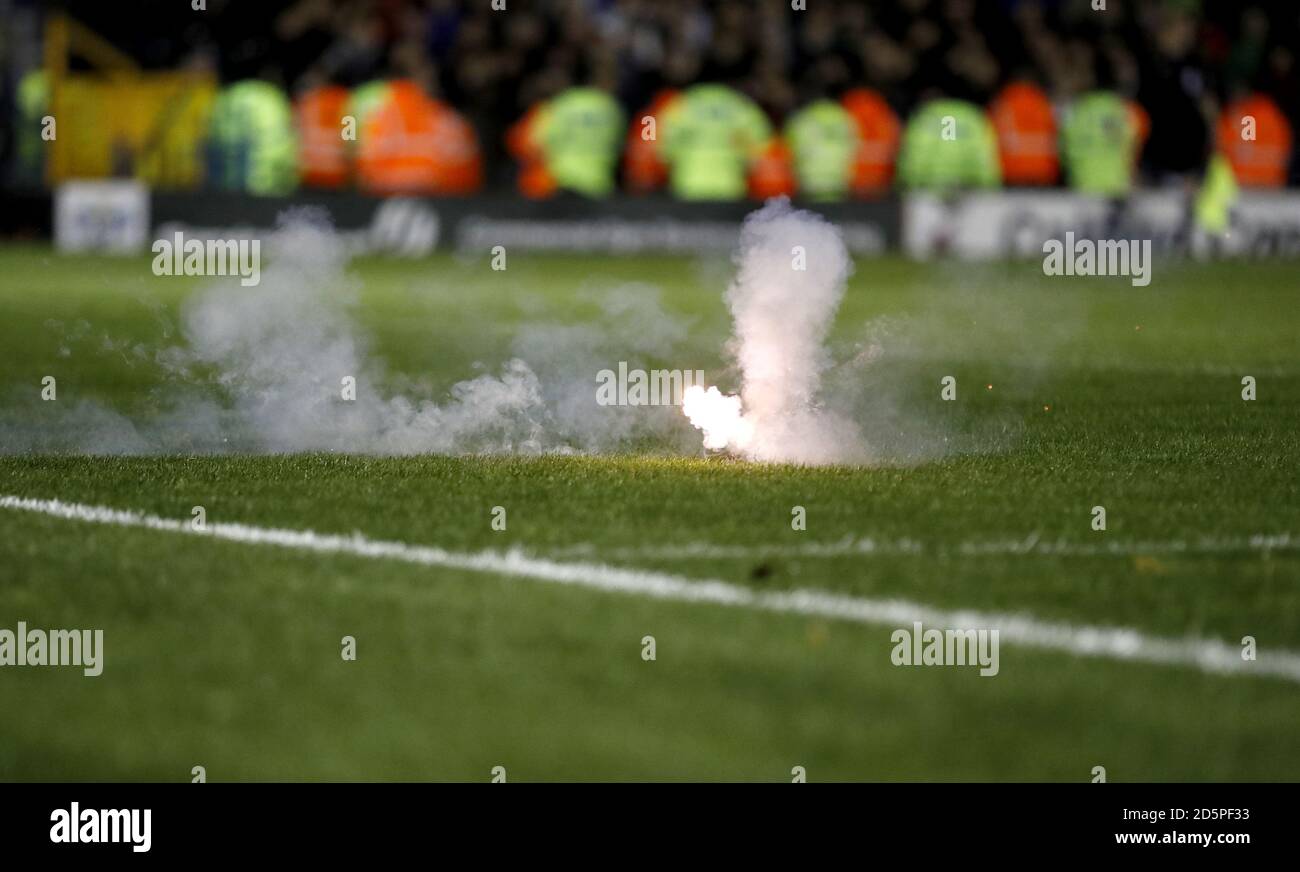 A flare is thrown on the pitch Stock Photo - Alamy