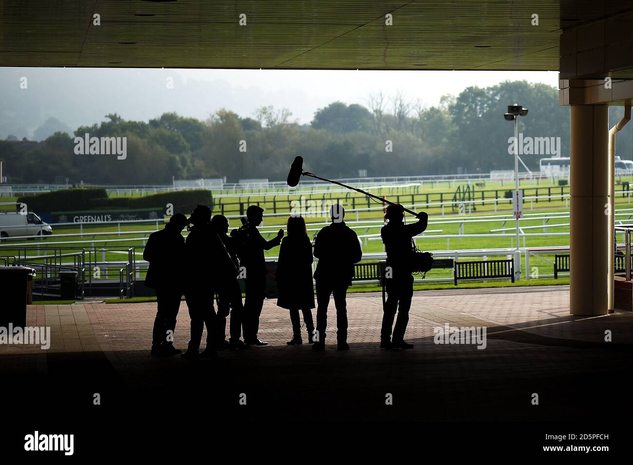 A silhouette of the new ITV racing team filming at Cheltenham ...