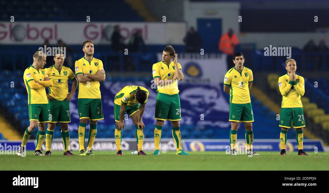 Norwich City players stand dejected as they lose the penalty shootout ...