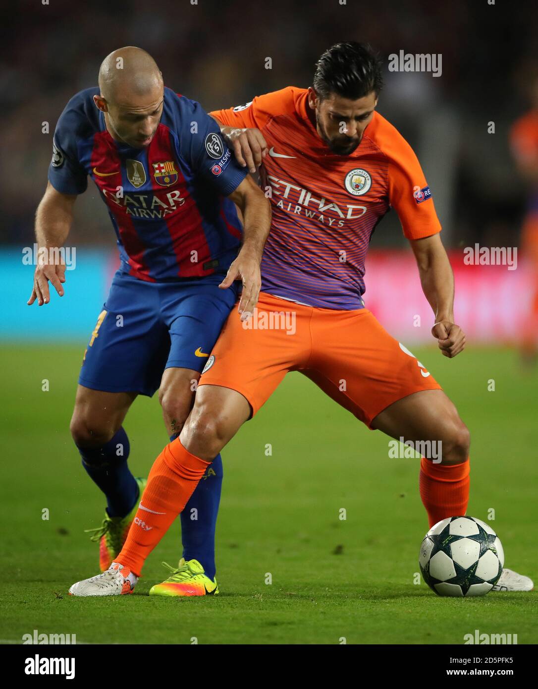 Barcelona's Javier Mascherano and Manchester City's Nolito battle for ...