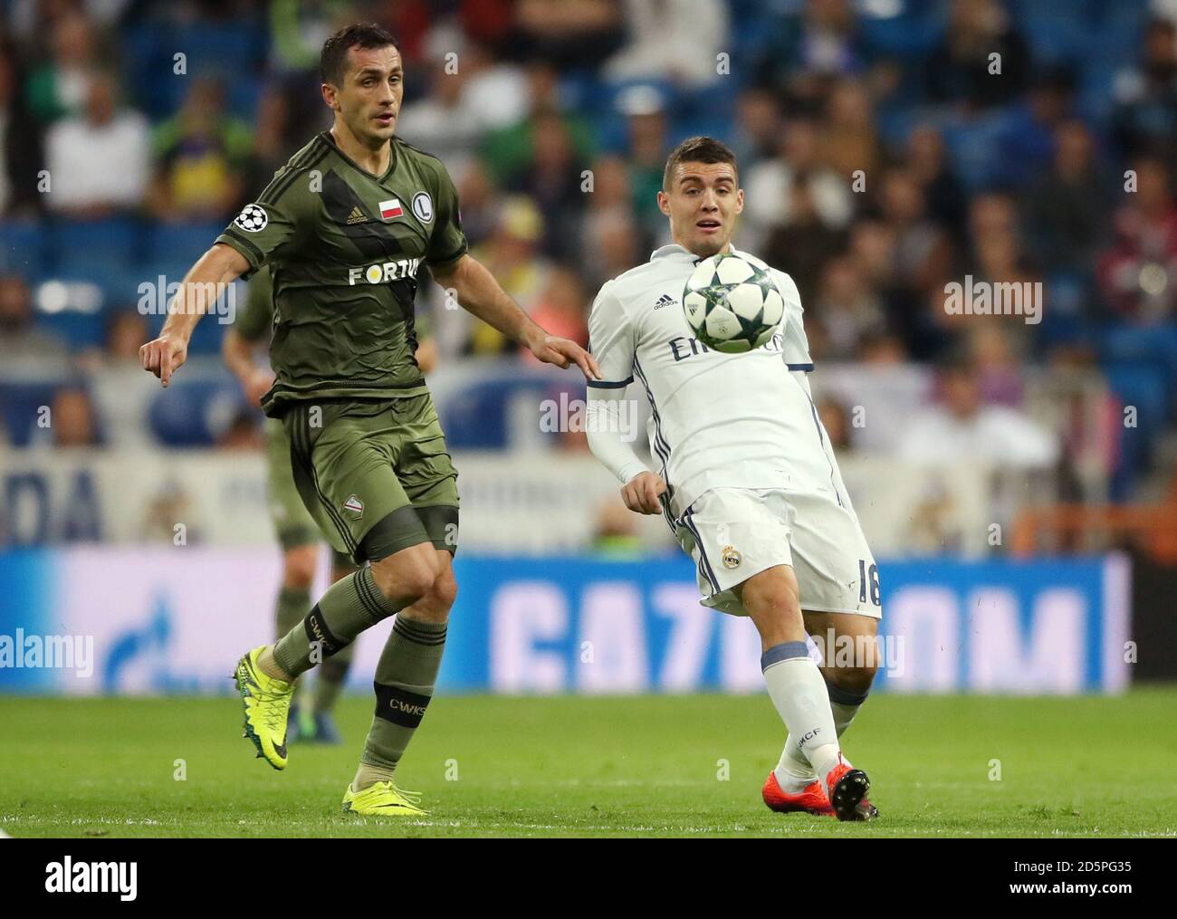 Legia Warsaw's Miroslav Radovic and Real Madrid's Mateo Kovacic battle ...