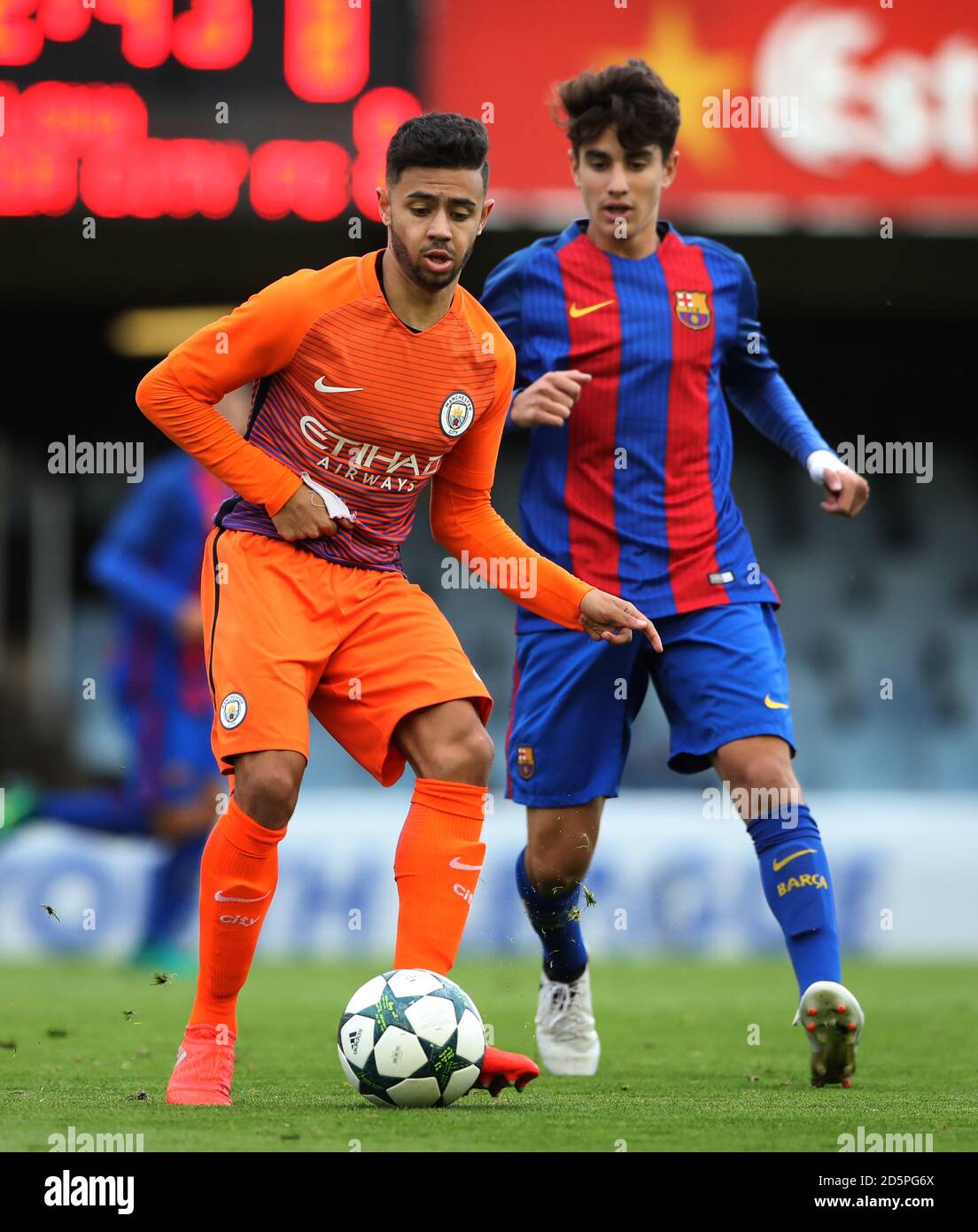 Manchester City's Paolo Fernandes (left) and Barcelona's Alex Collado ...