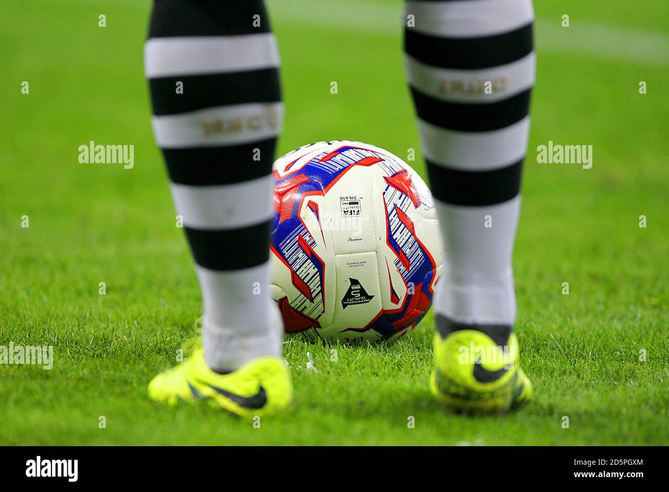 Detaill of the matchday ball in between the legs if a Newcastle United ...