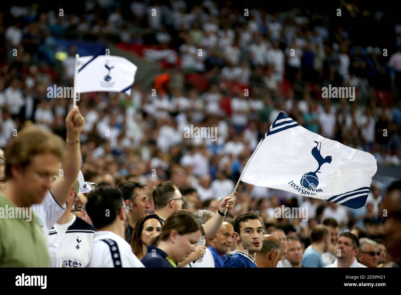 Tottenham Hotspur flags are waved in the stands Stock Photo - Alamy