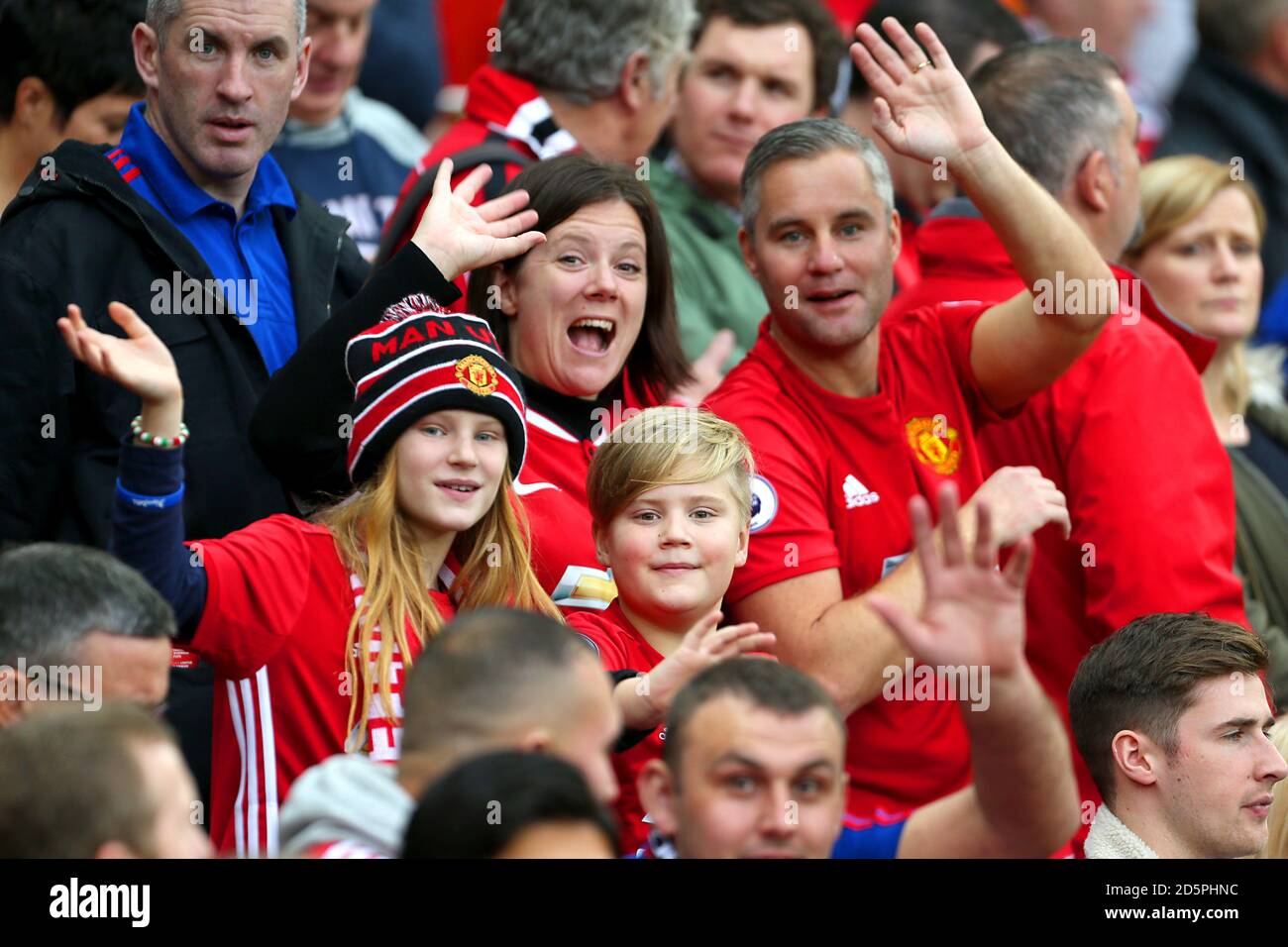 Manchester United fans in the stands Stock Photo - Alamy