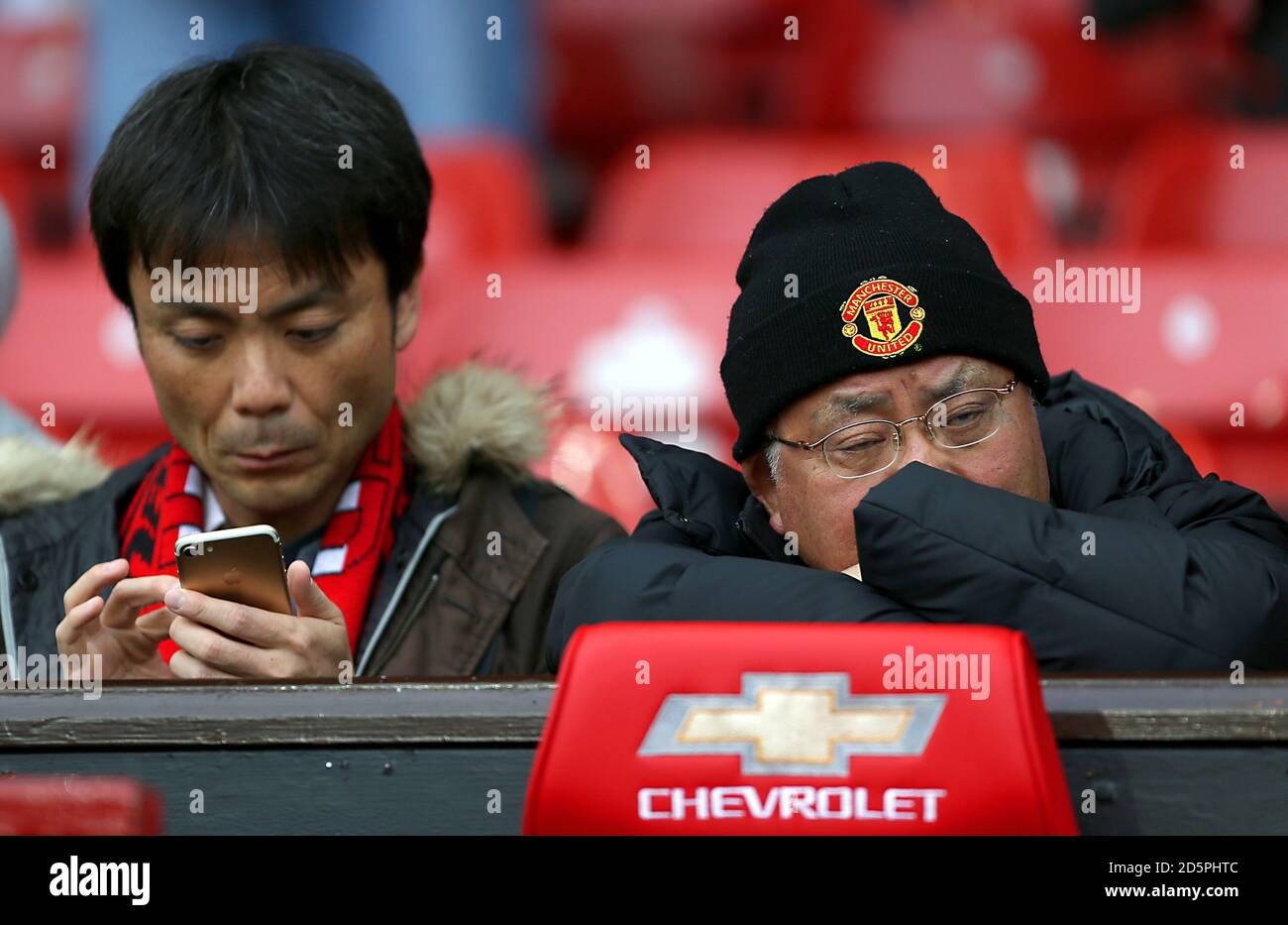 Manchester United fans in the stands Stock Photo - Alamy