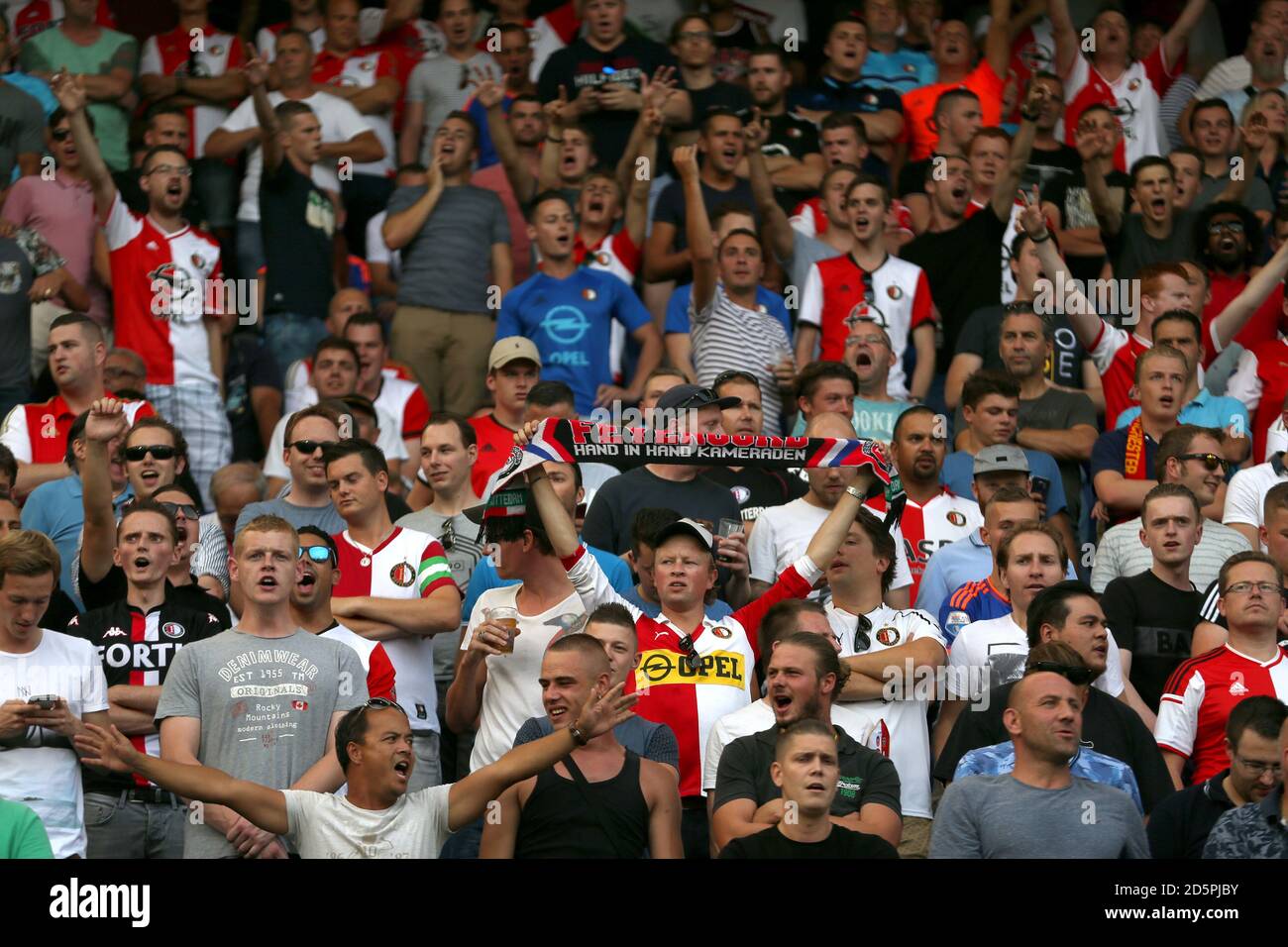 Feyenoord fans cheer on their side in the stands Stock Photo - Alamy