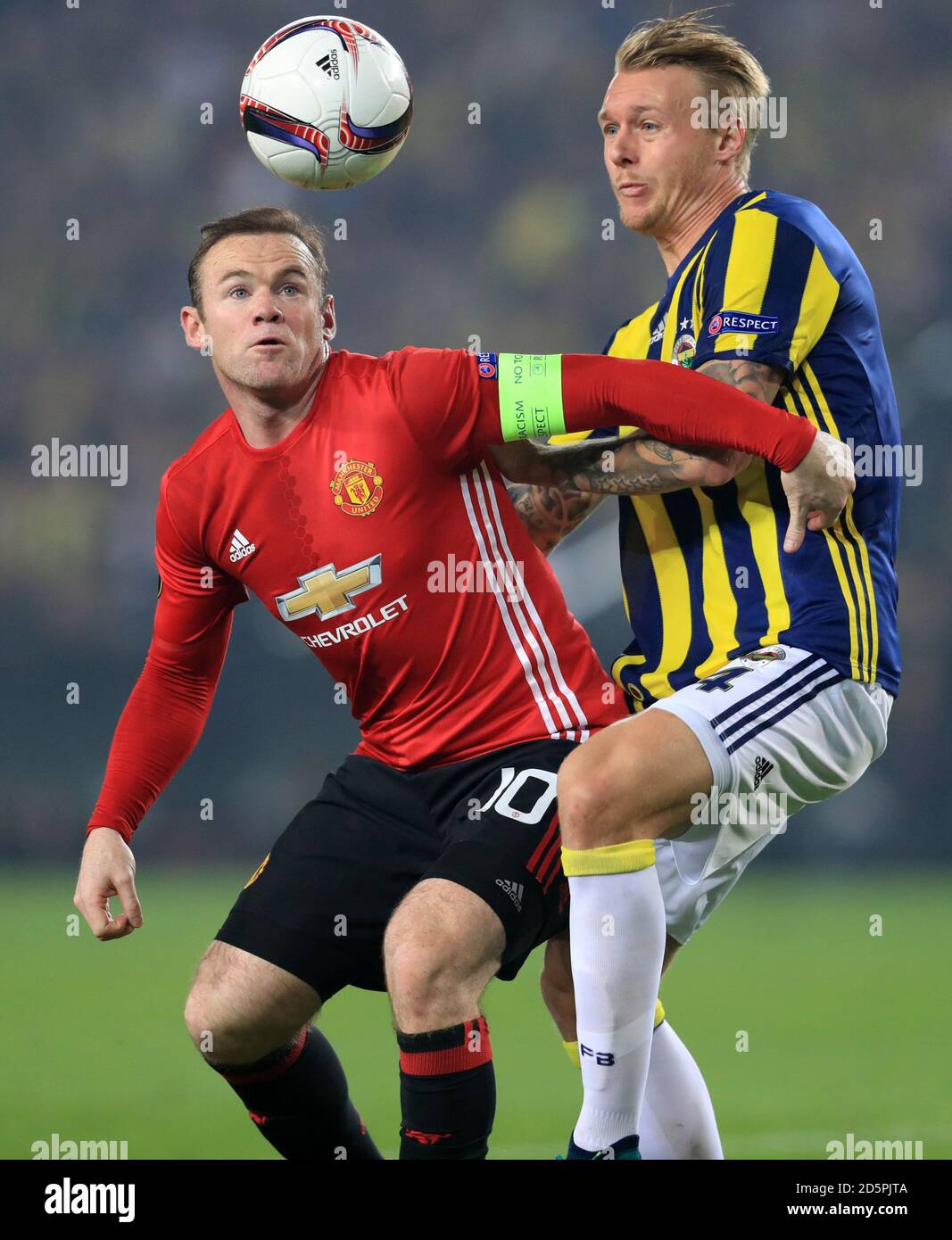 Manchester United's Wayne Rooney and SK Fenerbahce's Simon Kjaer battle ... Manchester United's Wayne Rooney and SK Fenerbahce's Simon Kjaer battle ...