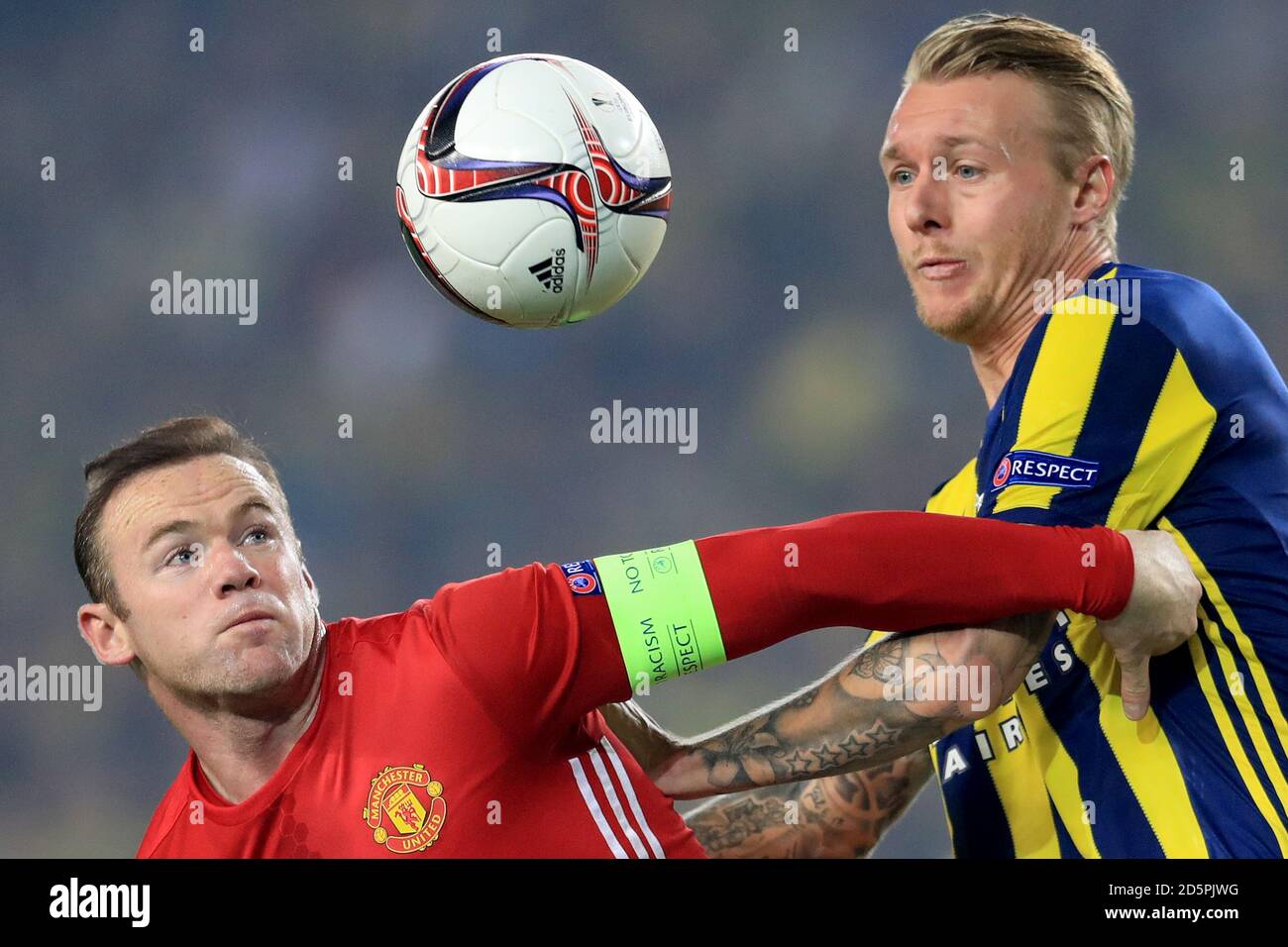 Manchester United's Wayne Rooney and SK Fenerbahce's Simon Kjaer battle ... Manchester United's Wayne Rooney and SK Fenerbahce's Simon Kjaer battle ...