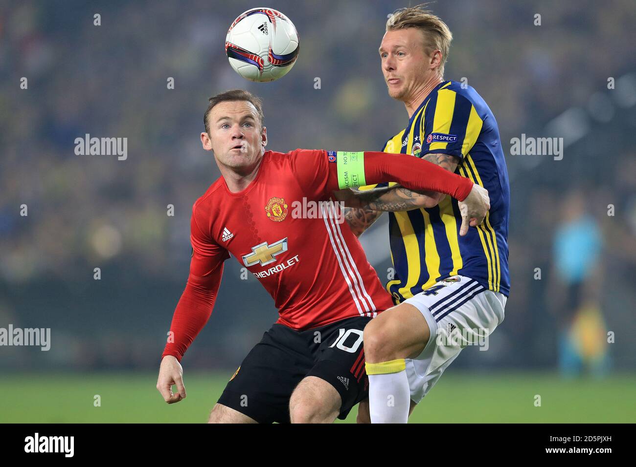 Manchester United's Wayne Rooney and SK Fenerbahce's Simon Kjaer battle ... Manchester United's Wayne Rooney and SK Fenerbahce's Simon Kjaer battle ...