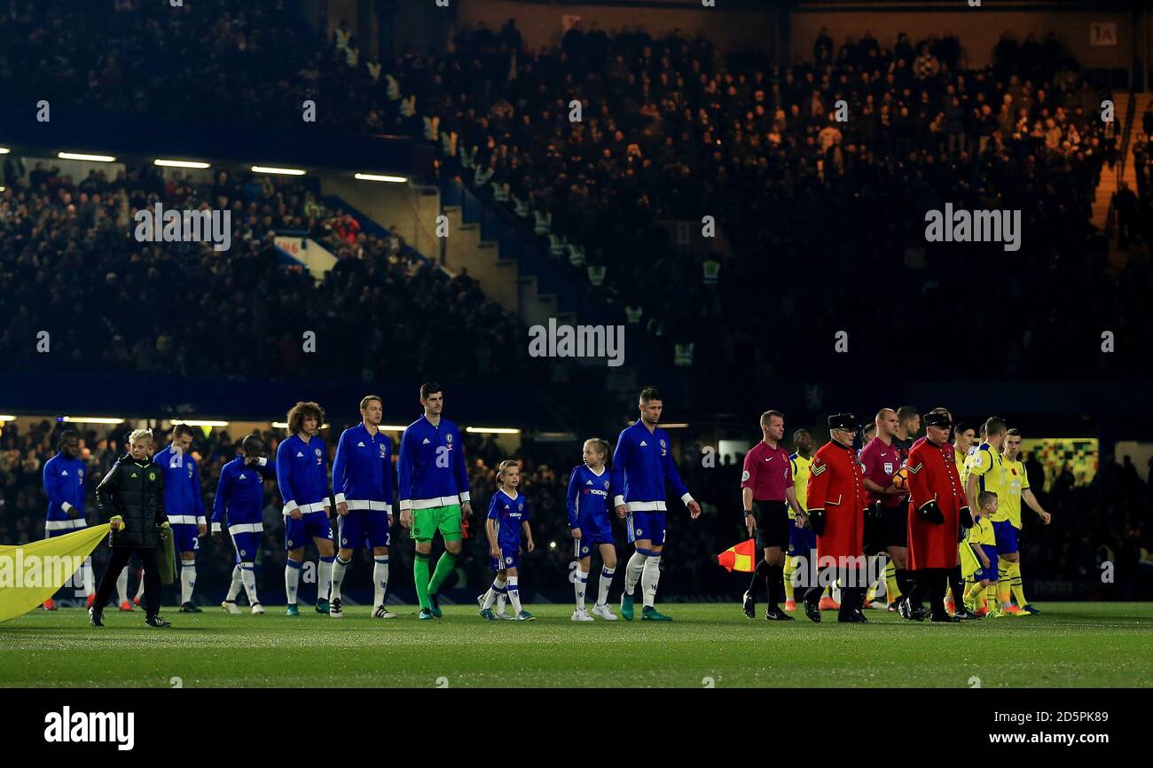 The two team's walk out before kick-off Stock Photo - Alamy