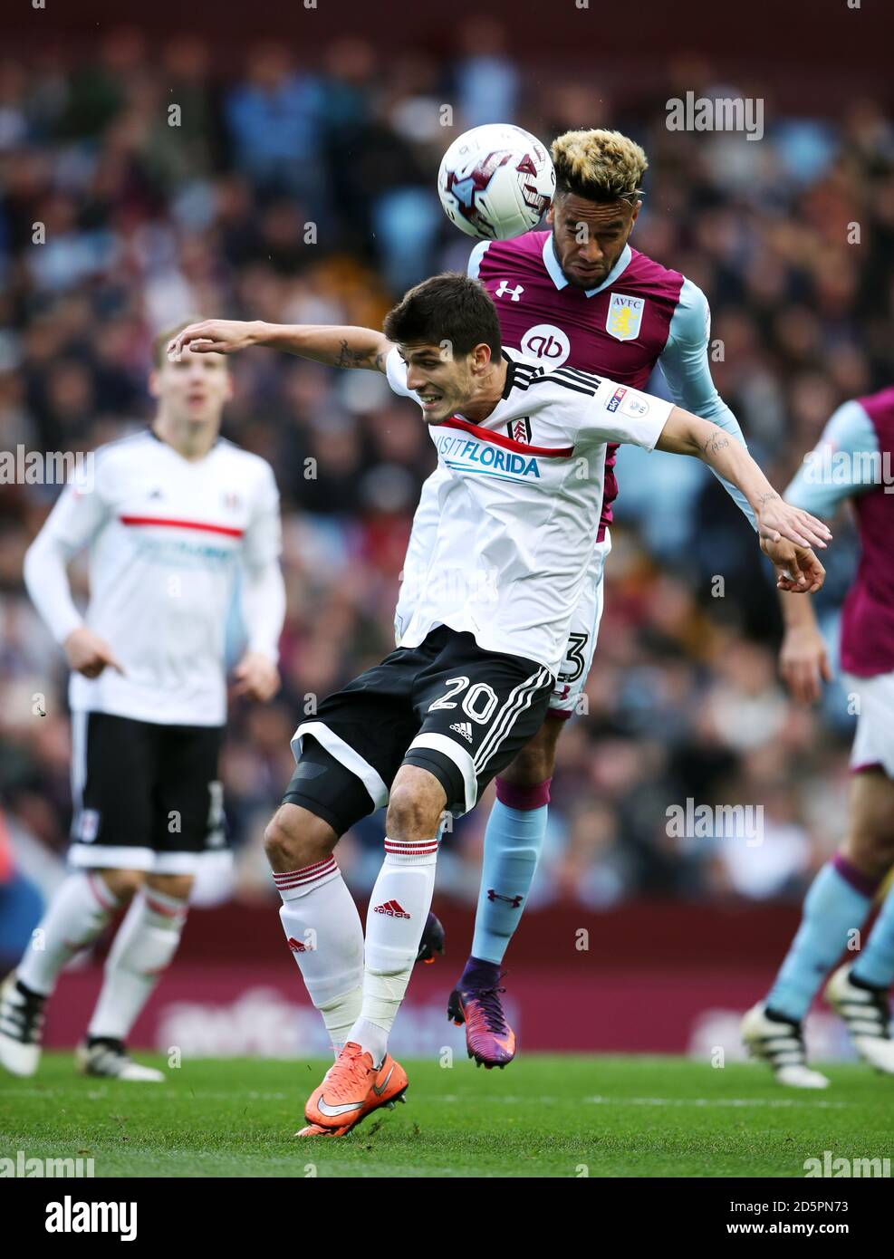 Aston Villa's Jordan Amavi wins an aerial dual with Fulham's Lucas ...