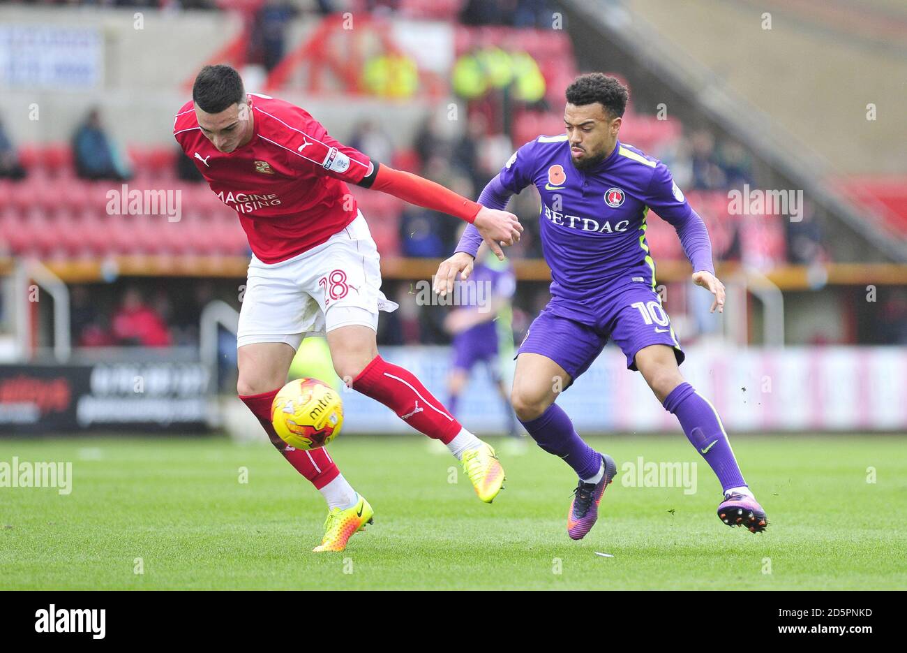 Swindon Town's Lloyd Jones and Charlton Athletic's Nicky Ajose (right ...
