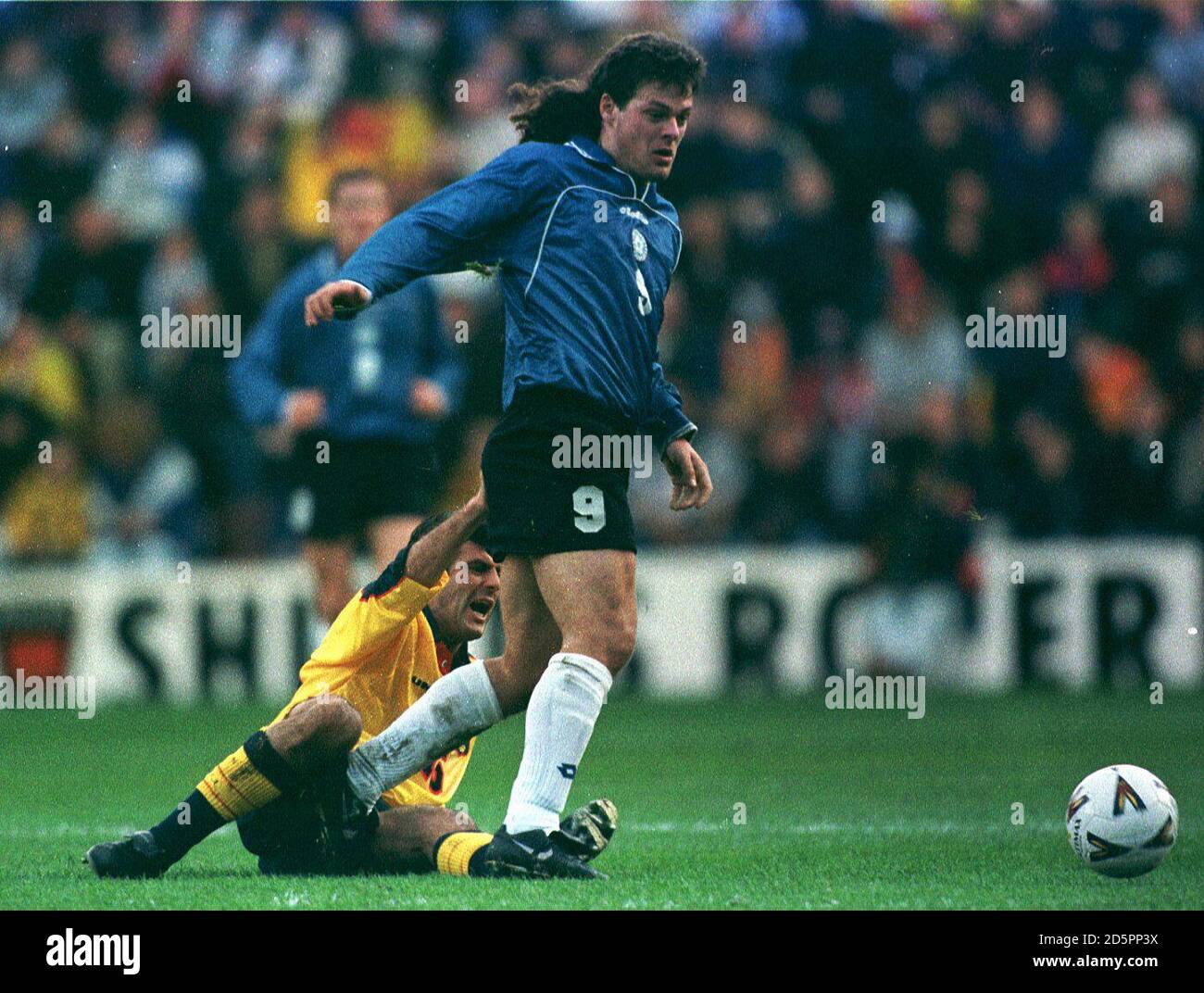 Scotland's Darren Jackson (left) tries to tackle Estonia's Marko ...