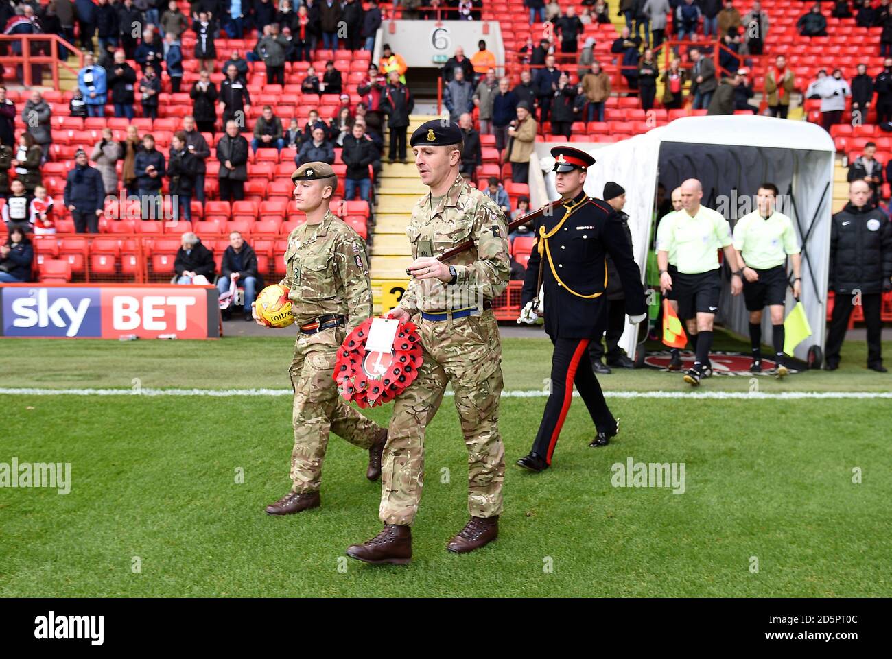 Charlton Athletic players and Port Vale players are lead out by ...
