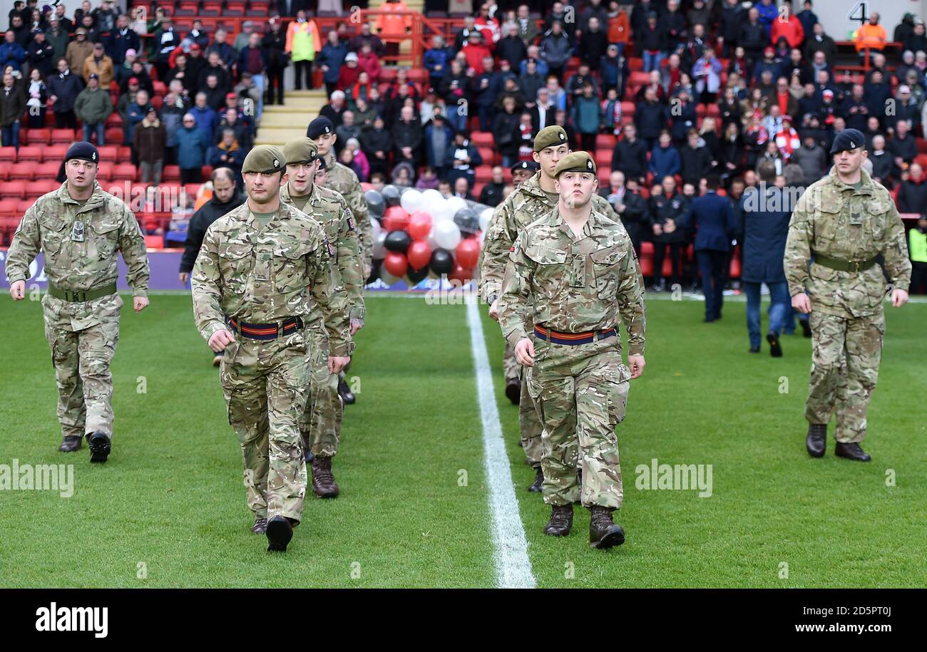Military personnel on the pitch before kick off Stock Photo - Alamy