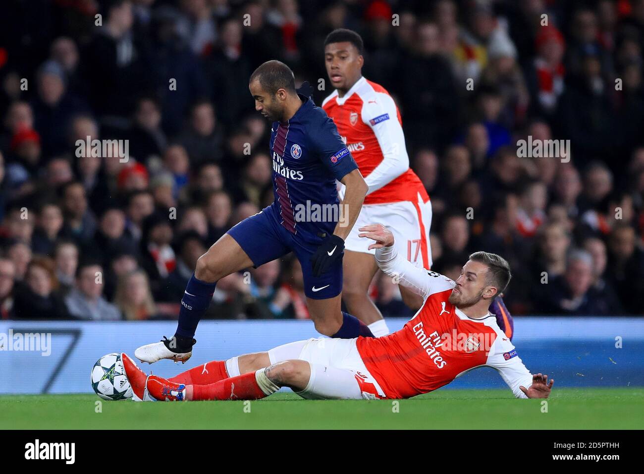 Paris Saint-Germain's Lucas Moura (left) reacts to a challenge from ...