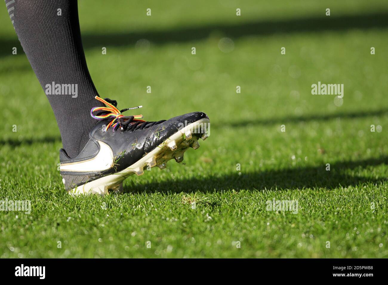 The referee wearing rainbow laces during the match Stock Photo - Alamy