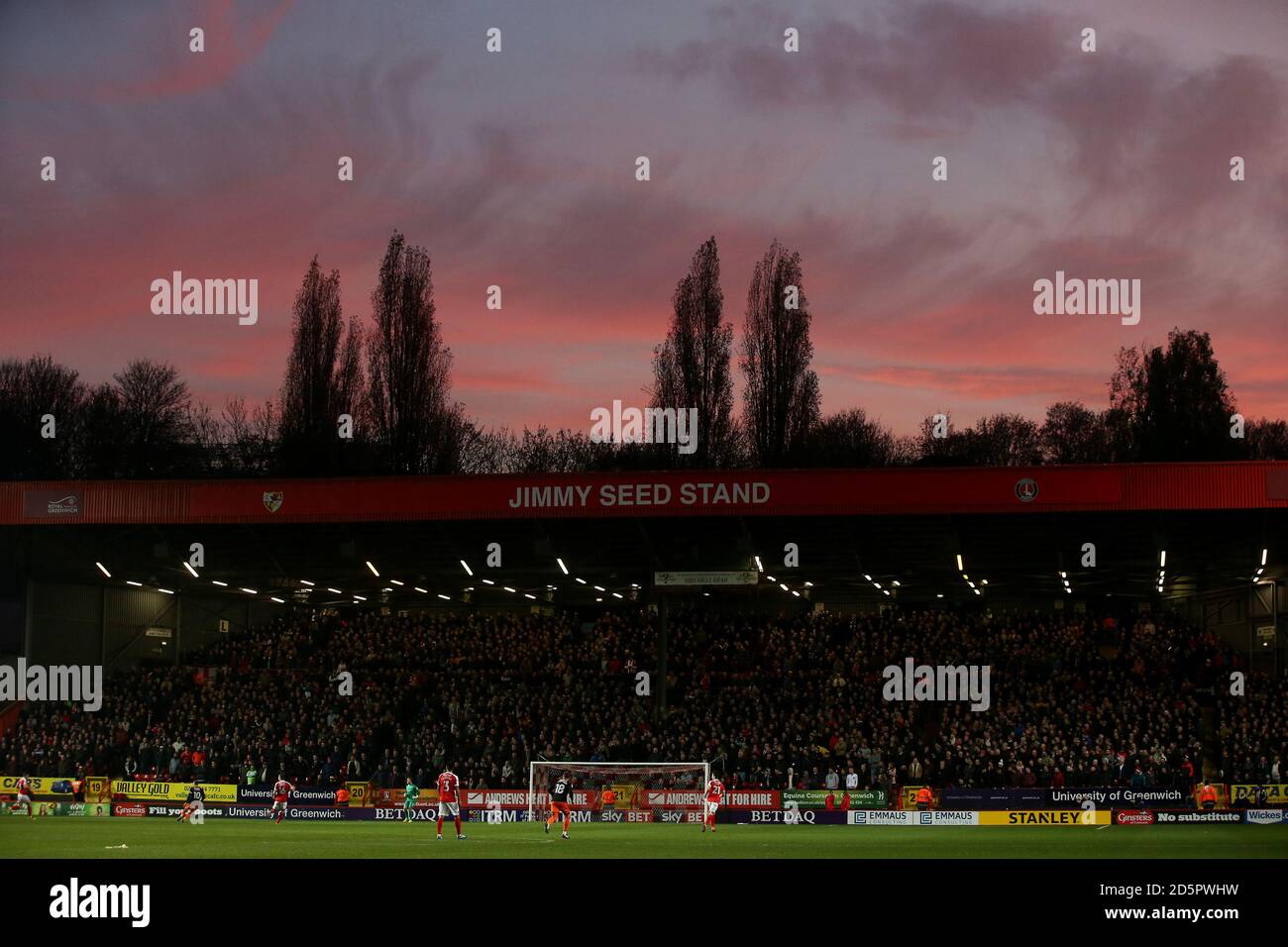 The sun sets over the Jimmy Seed stand Stock Photo - Alamy