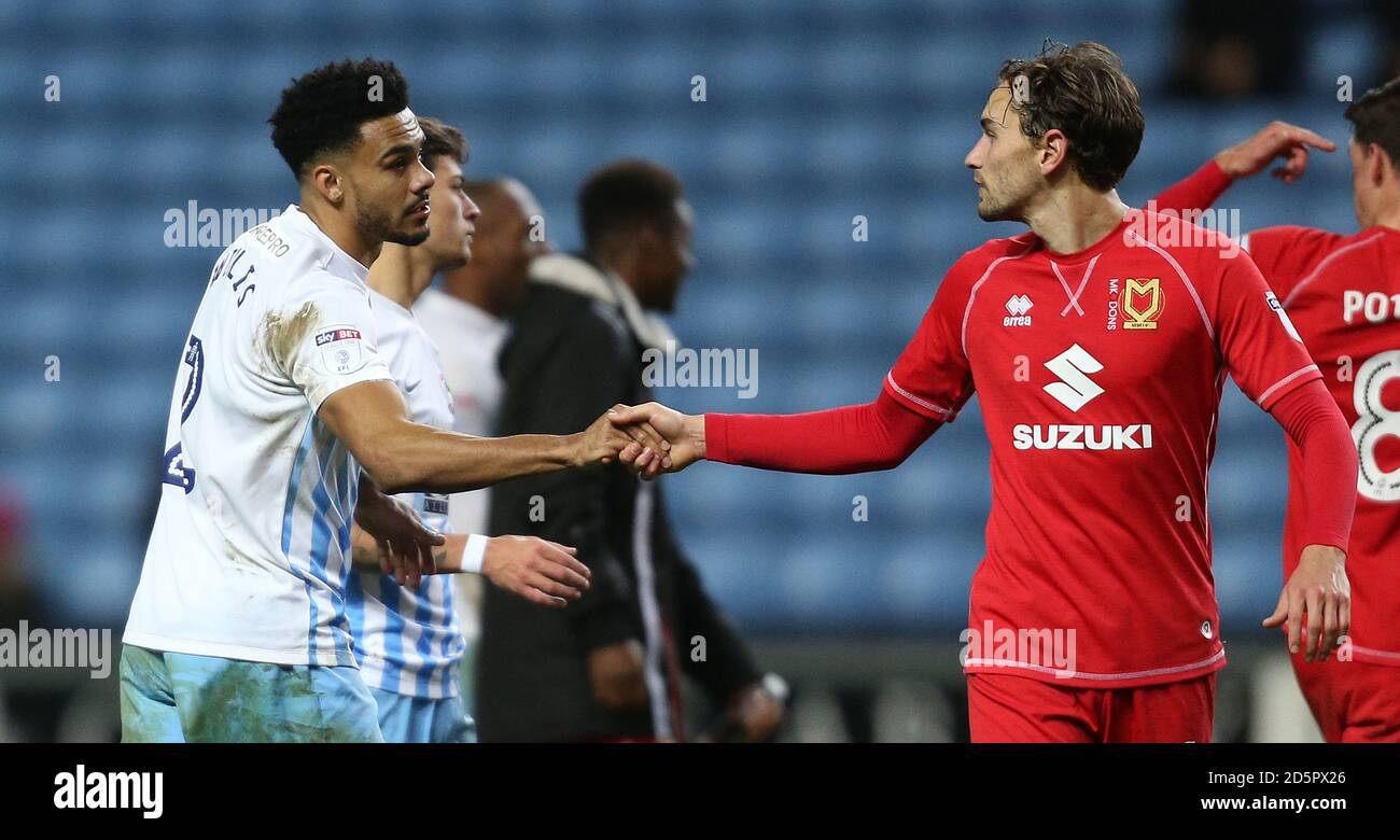 Coventry City's Jordan Willis (left) shakes hands with Milton Keynes ...