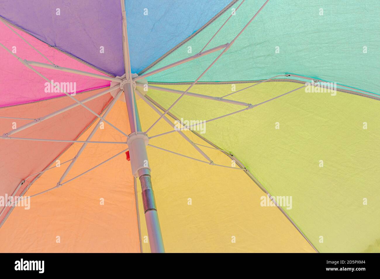 Colorful beach umbrella close up background texture. Rainbow colors ...