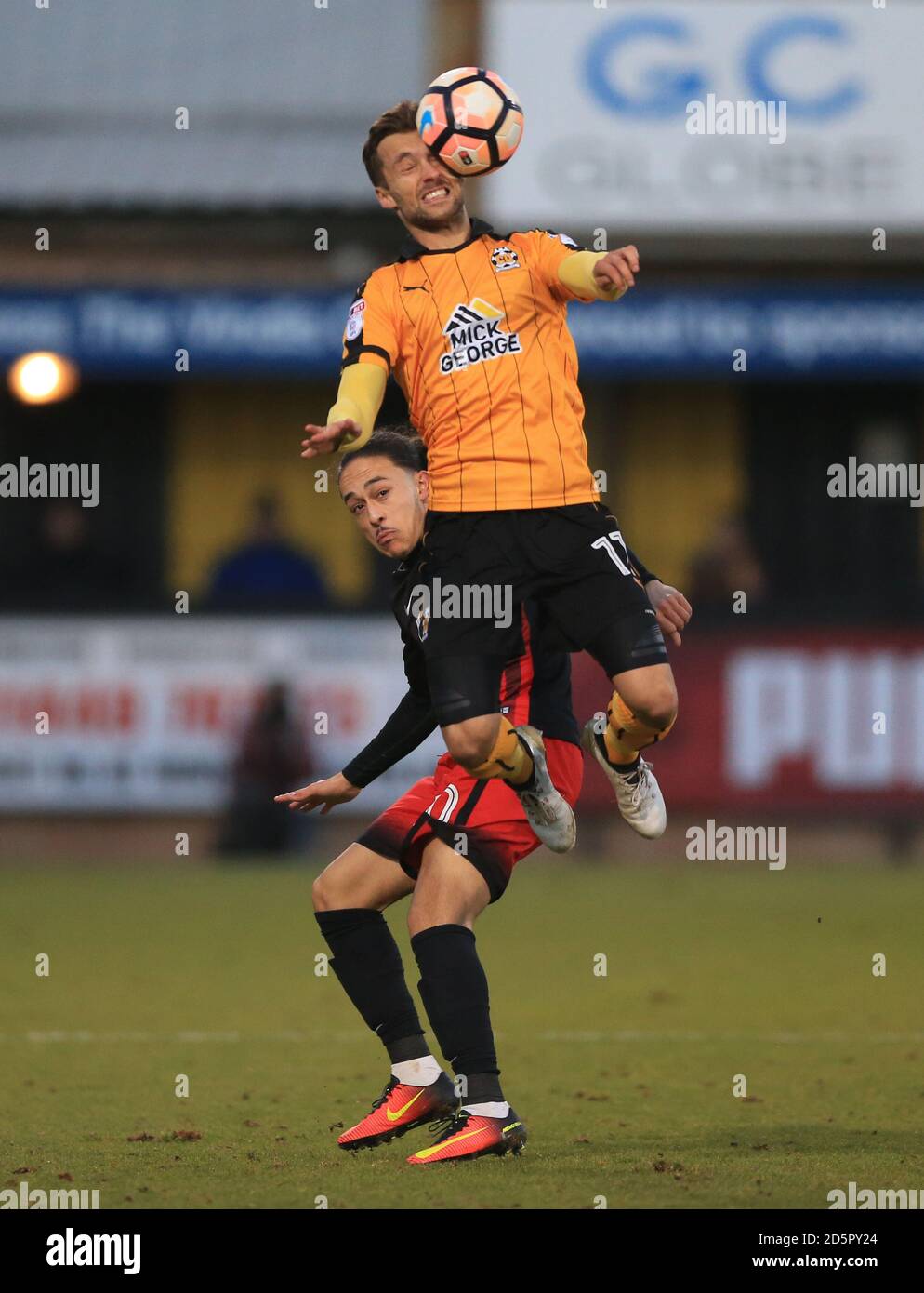 Cambridge United's Harrison Dunk (front) and Coventry City's Jodi Jones ...