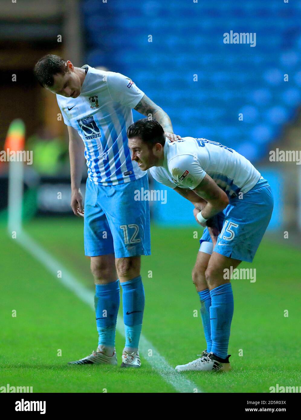 Coventry City's Chris McCann tends to Coventry City's Lewis Page who ...
