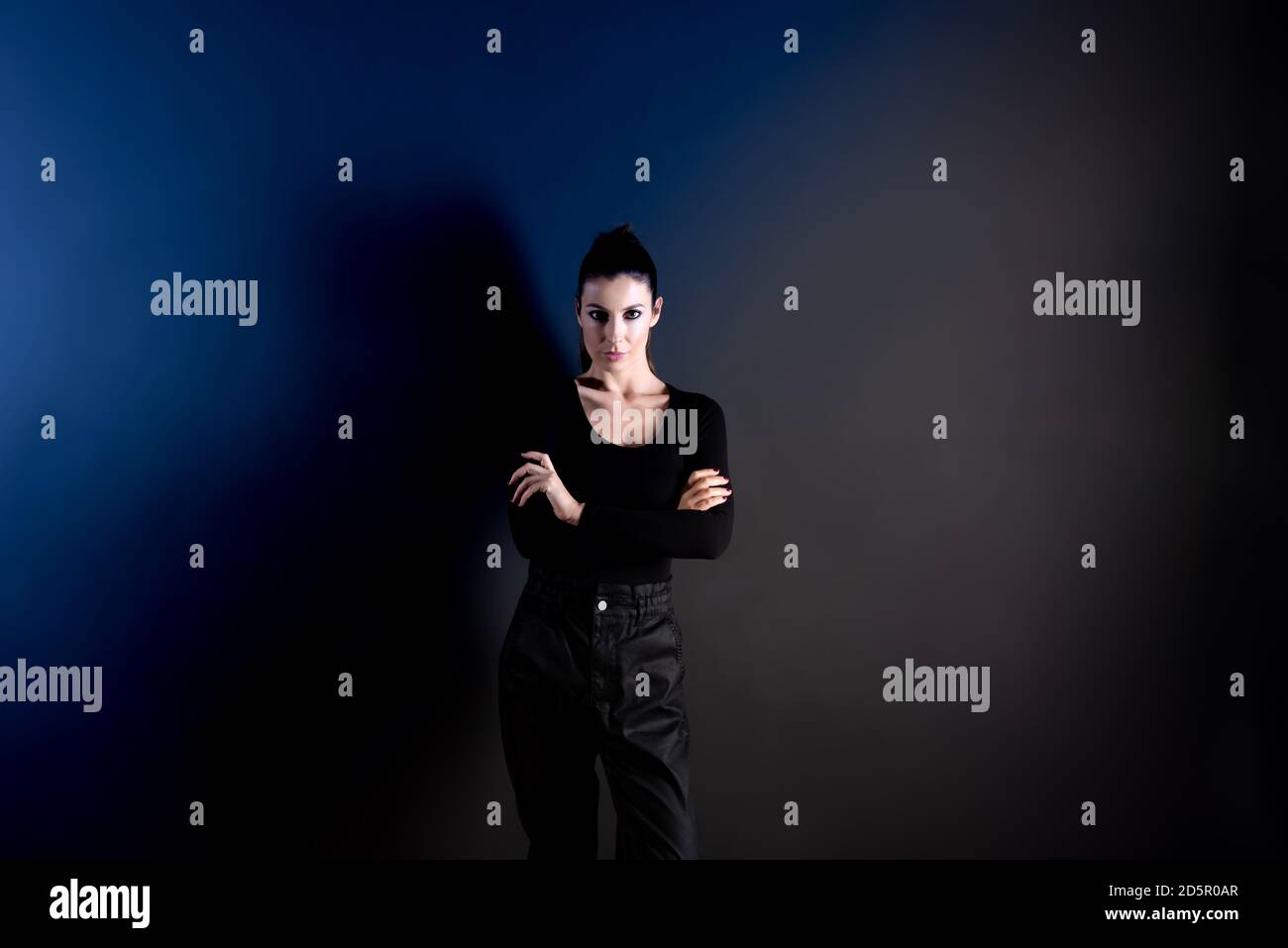 Dark Portrait of a beautiful strong woman on a black background Stock ...