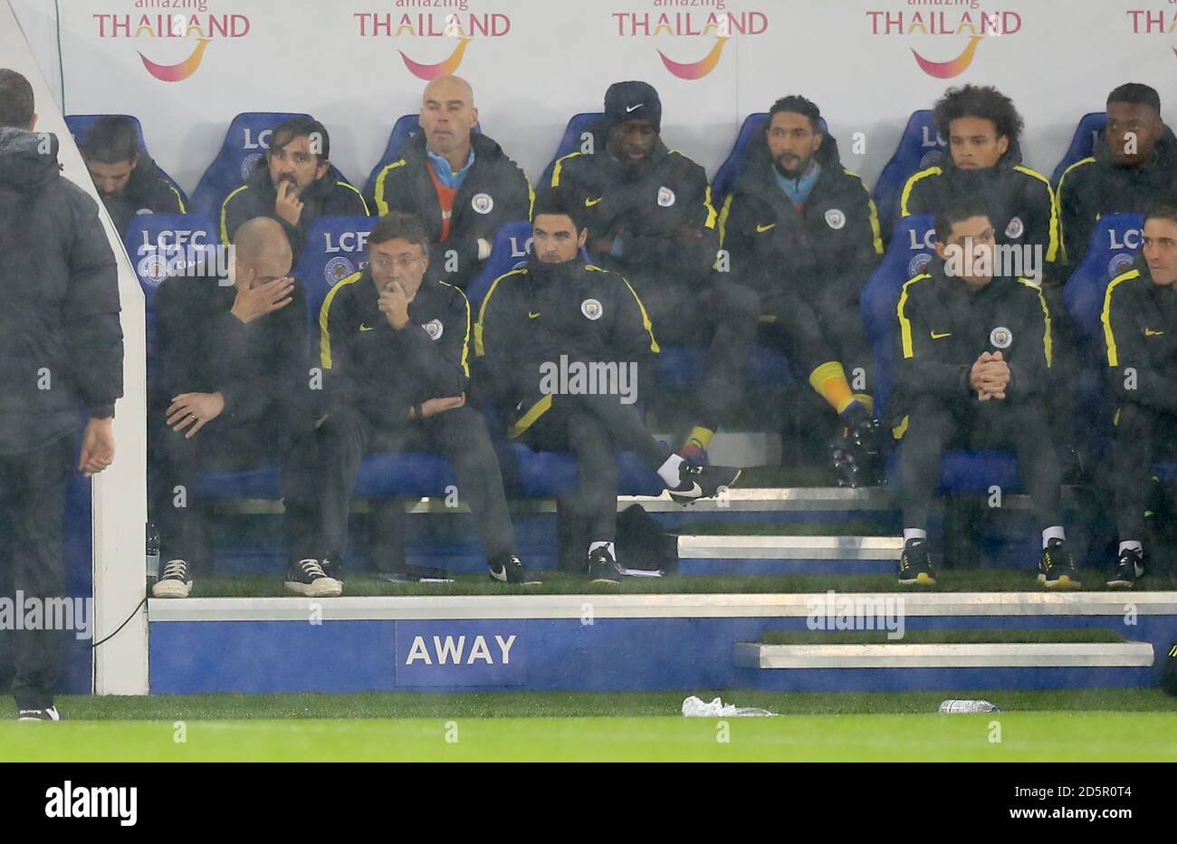 Manchester City manager Pep Guardiola looks on from the bench Stock ...